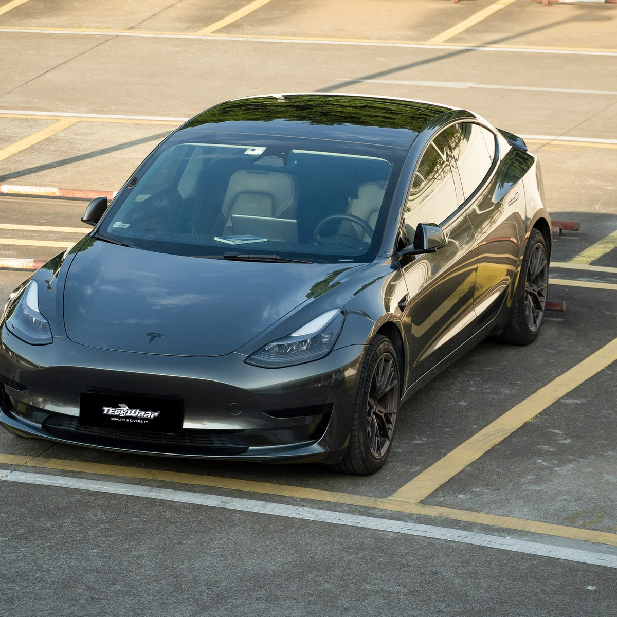 Vinyl wrapping Tesla fender with hardware on | TeckWrap – Teckwrap ...