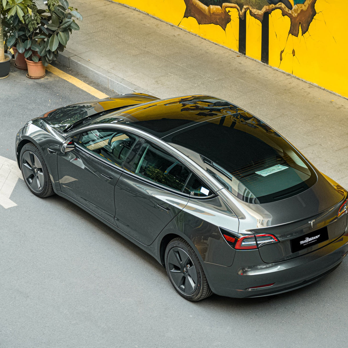 Vinyl wrapping Tesla trunk | TeckWrap – Teckwrap International