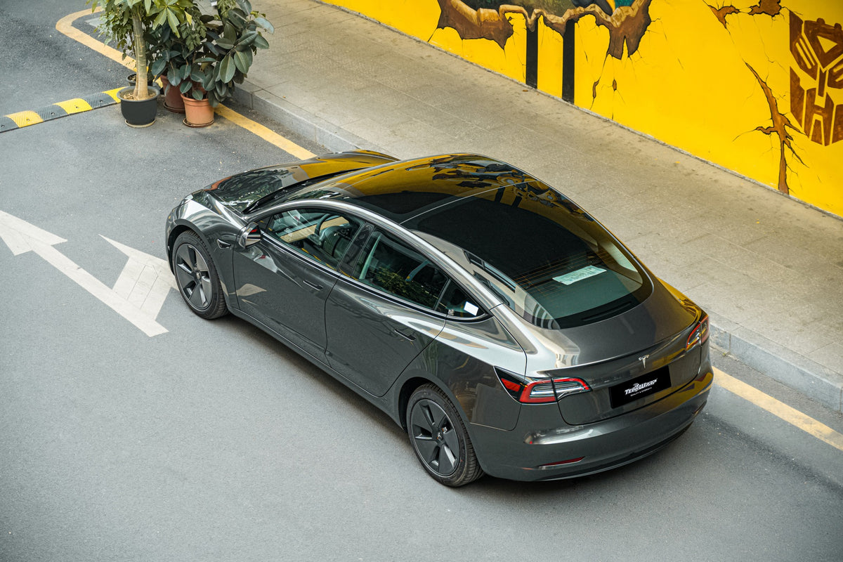 Vinyl wrapping Tesla trunk | TeckWrap – Teckwrap International